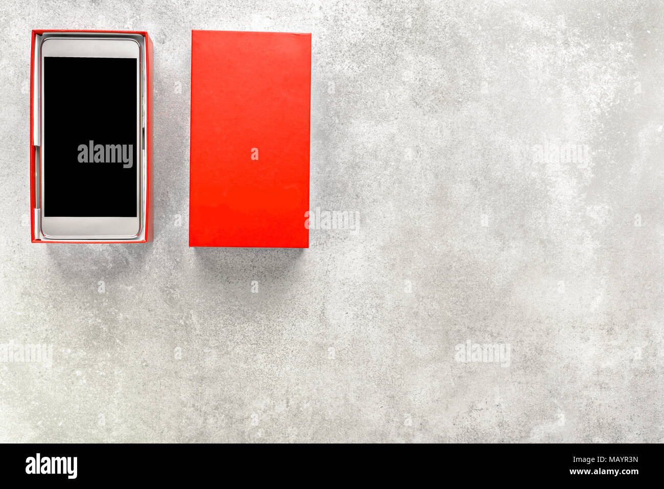 New mobile phone, gift box with smartphone with black screen and touch ...