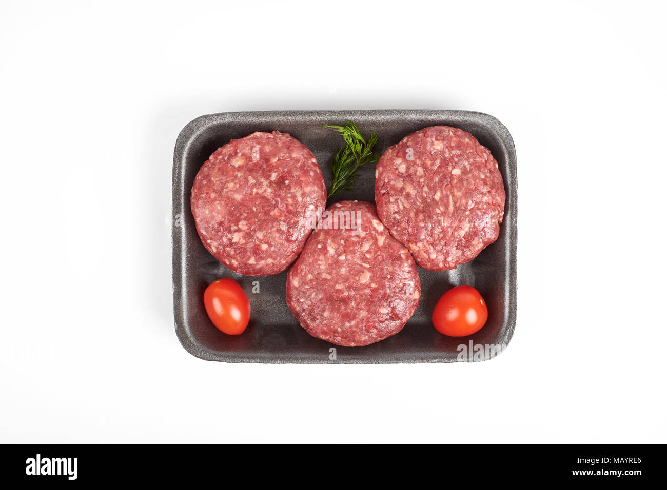 Tray with raw beef burgers or minced meat isolated on white background ...