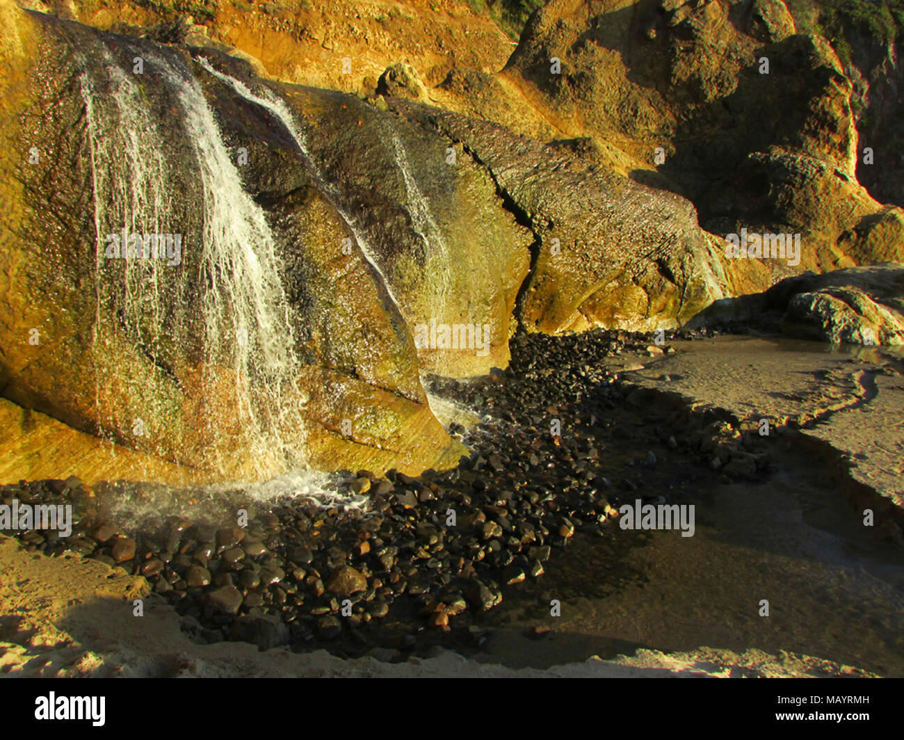 Waterfall at Hug Point Beach in Oregon Stock Photo - Alamy