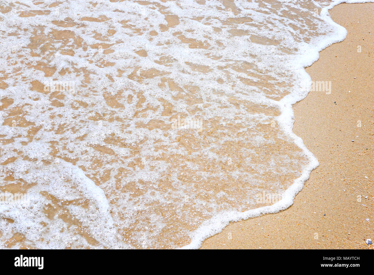 Wave on sand beach Stock Photo - Alamy