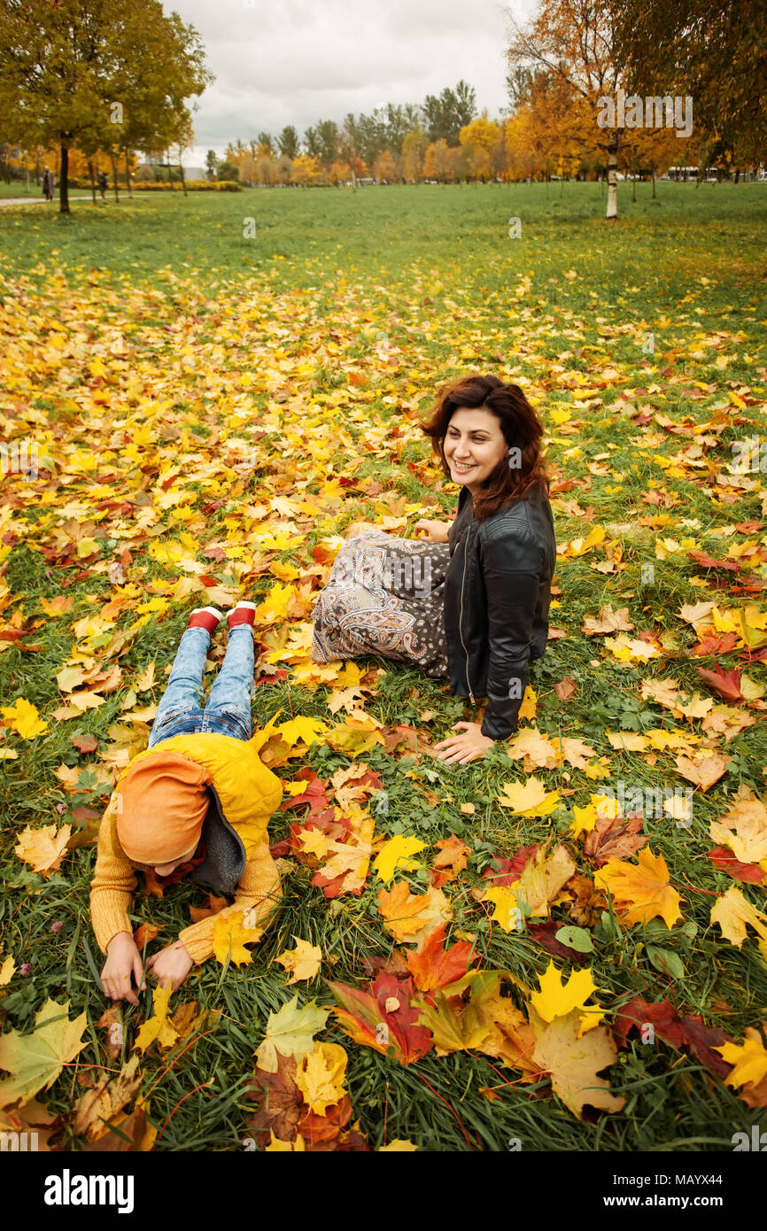 Happy Autumn Family in Fall Park Outdoors. Happy Mother and Child Boy ...