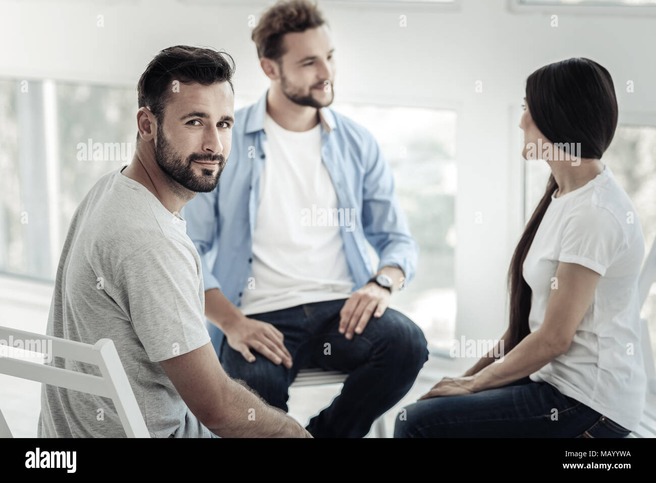 Positive nice man looking at you Stock Photo - Alamy