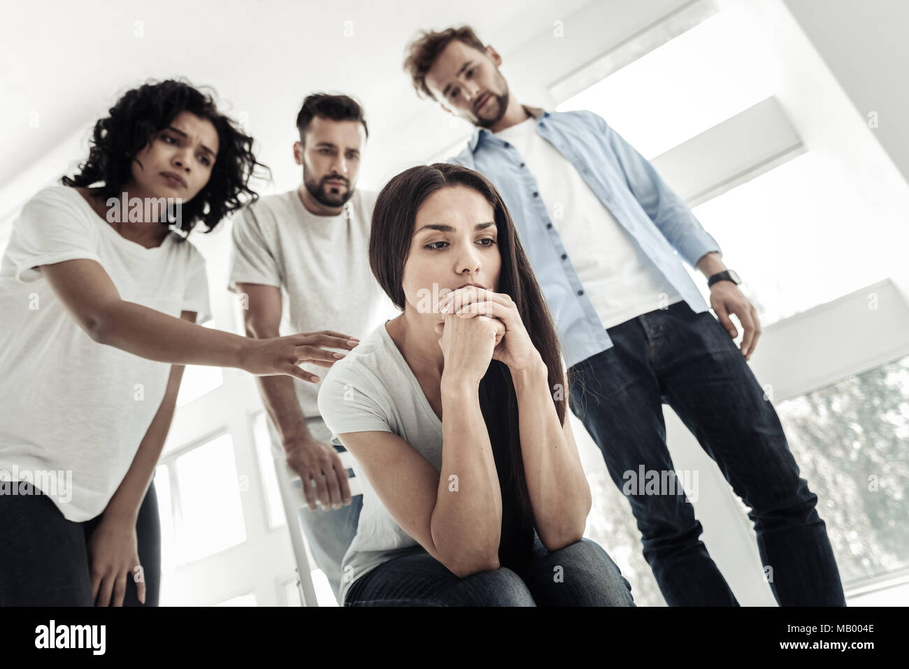 Cheerless moody woman concentrating on herself Stock Photo - Alamy