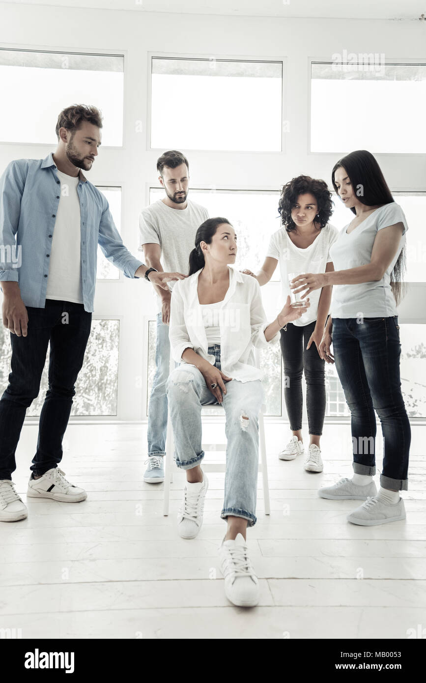 Nice friendly people supporting their friend Stock Photo - Alamy