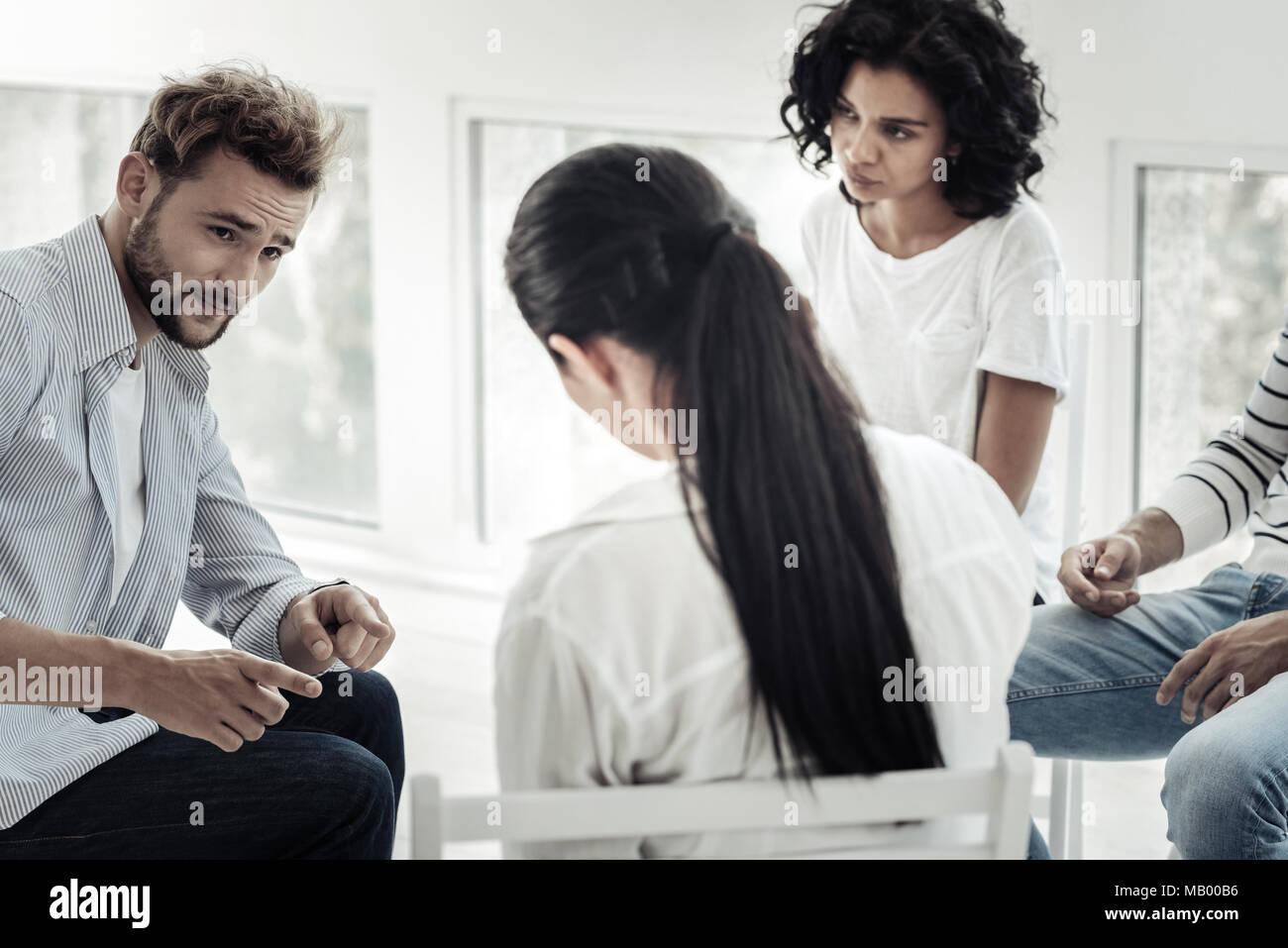 Nice young people talking to each other Stock Photo - Alamy