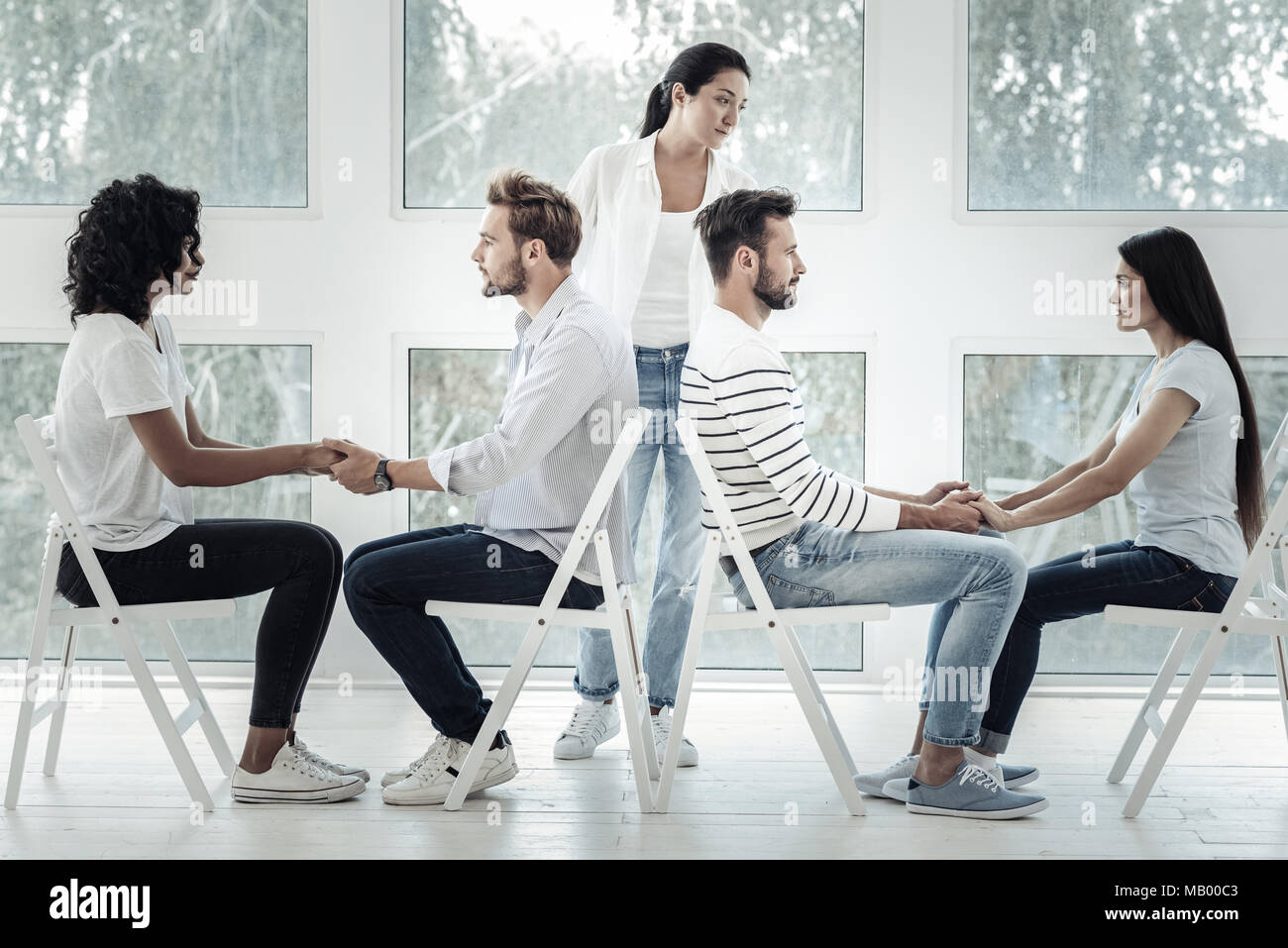 Nice young people taking part in the activity Stock Photo - Alamy