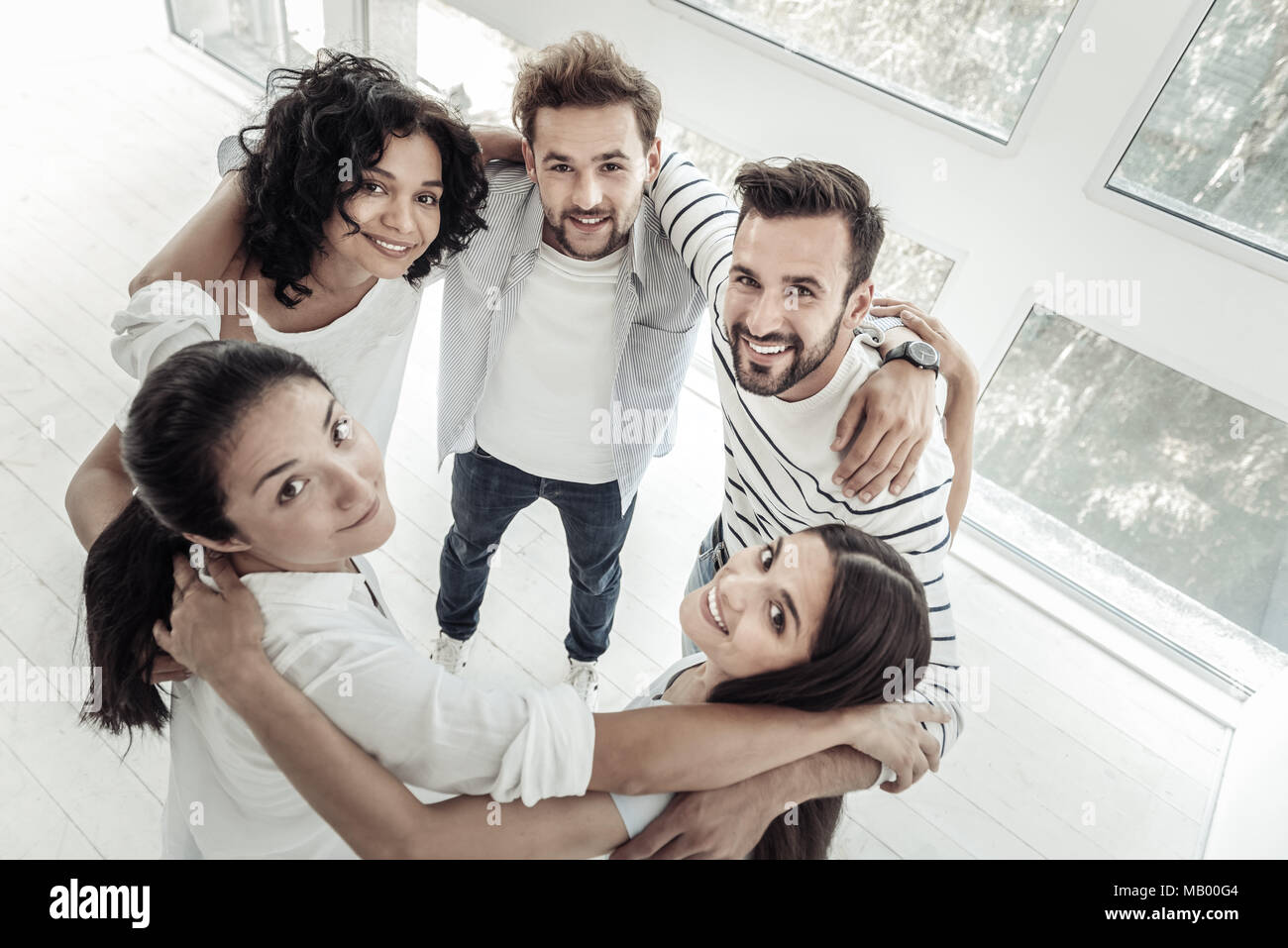 Top view of happy people looking at you Stock Photo - Alamy
