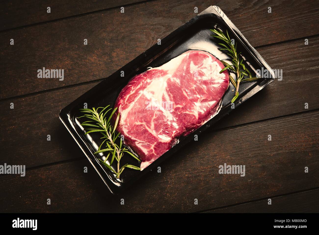 Raw steak in an airtight packaging Stock Photo - Alamy