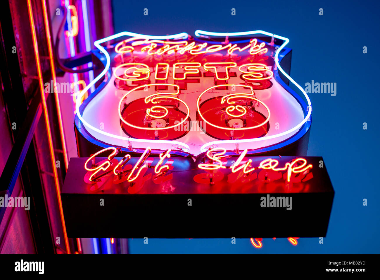 Neon gift shop sign at dusk Stock Photo - Alamy