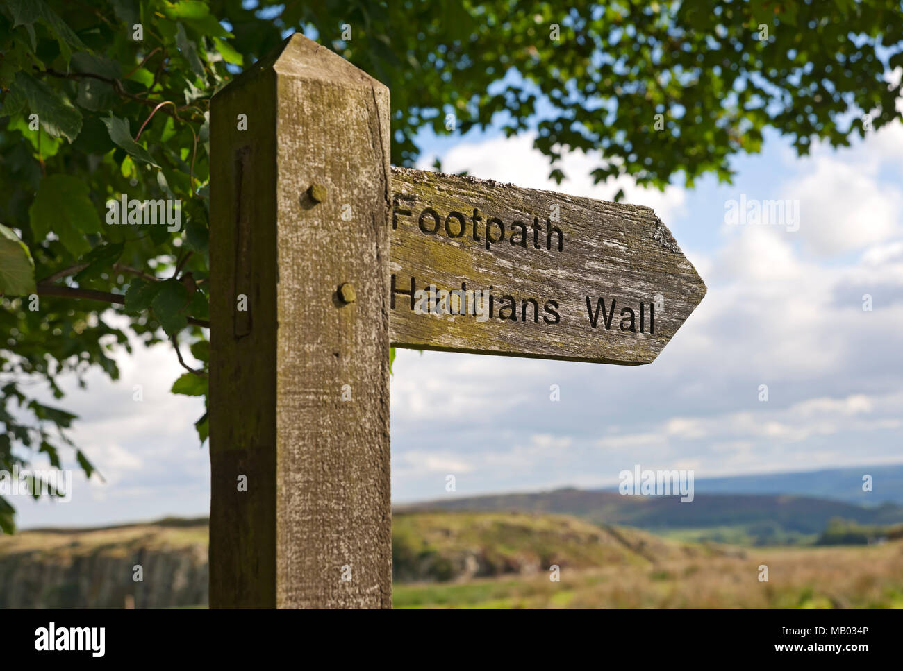 Footpath sign pointing to Hadrians Wall Stock Photo - Alamy