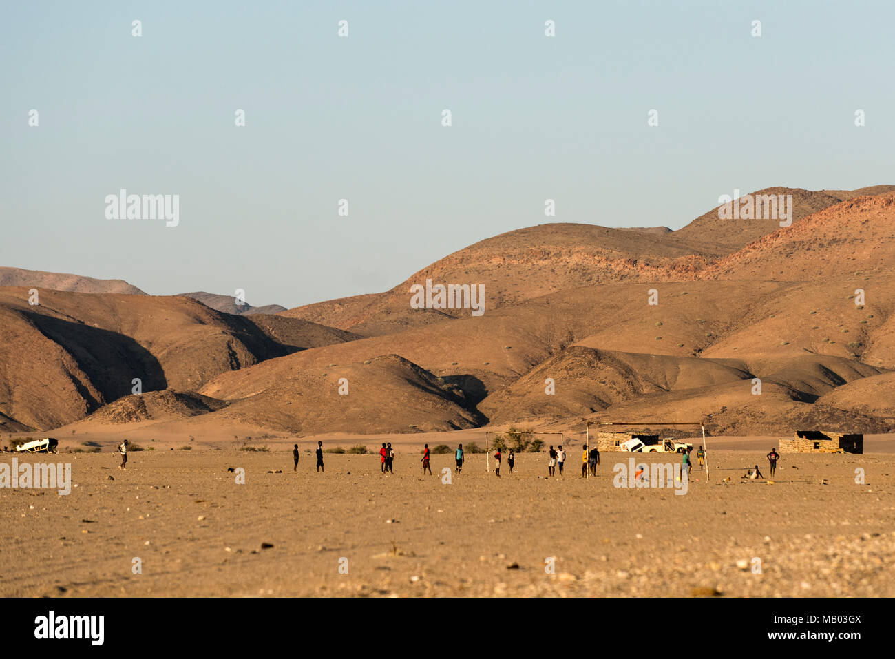 Kids playing football in the remote village of Purros in Kaokaland in ...