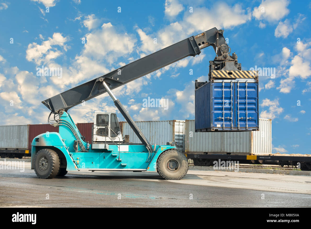 Container unloading truck in logistics yard Stock Photo - Alamy