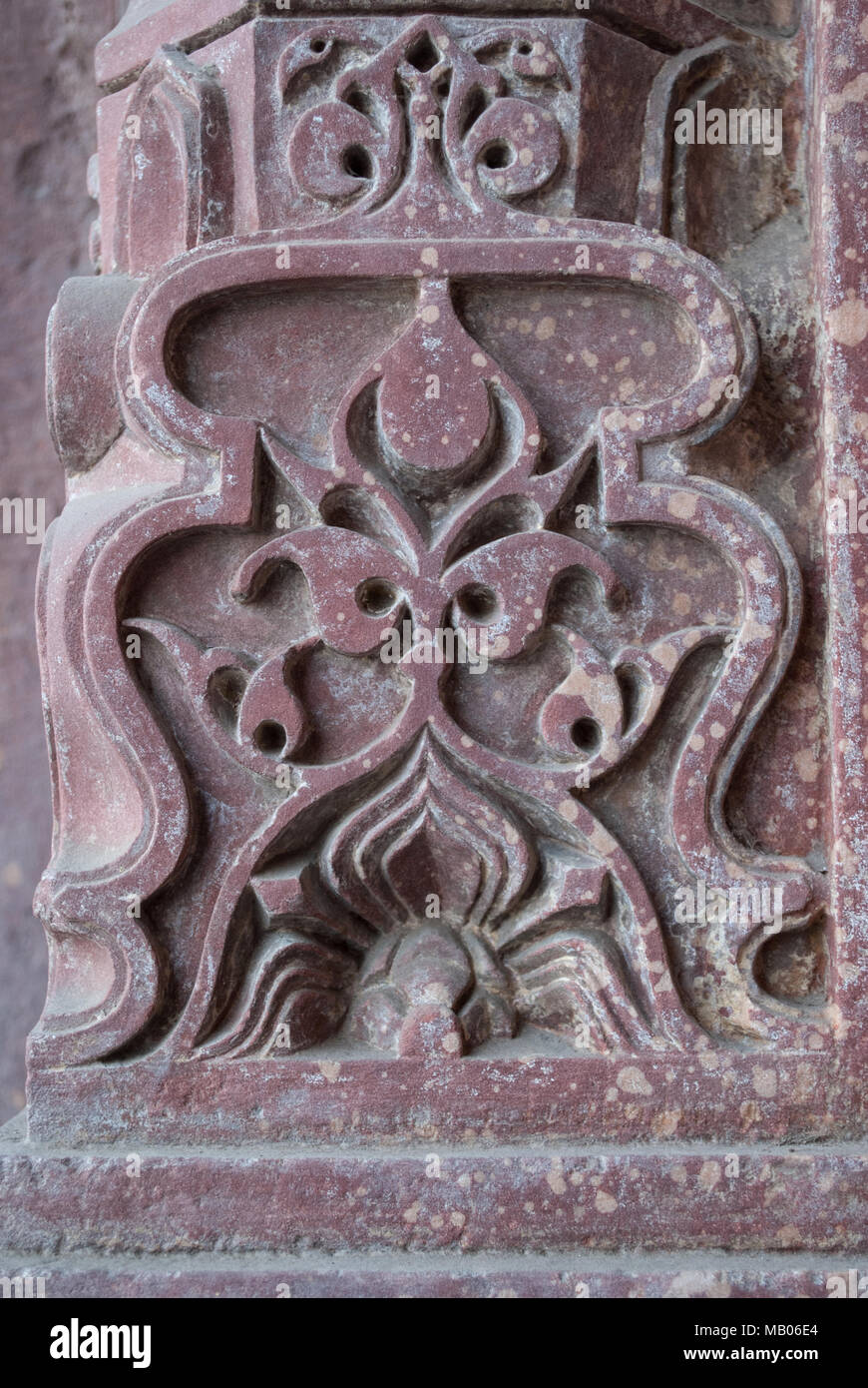 Floral design on stone wall Stock Photo - Alamy