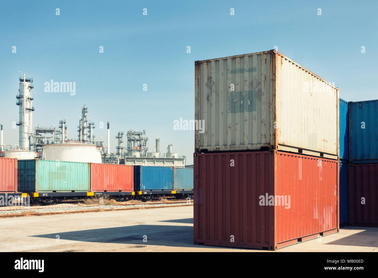 Container yard and transport train on oil refinery background Stock ...