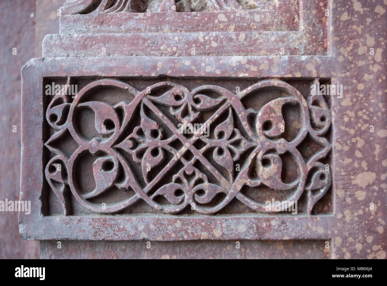 Floral design on stone wall Stock Photo - Alamy
