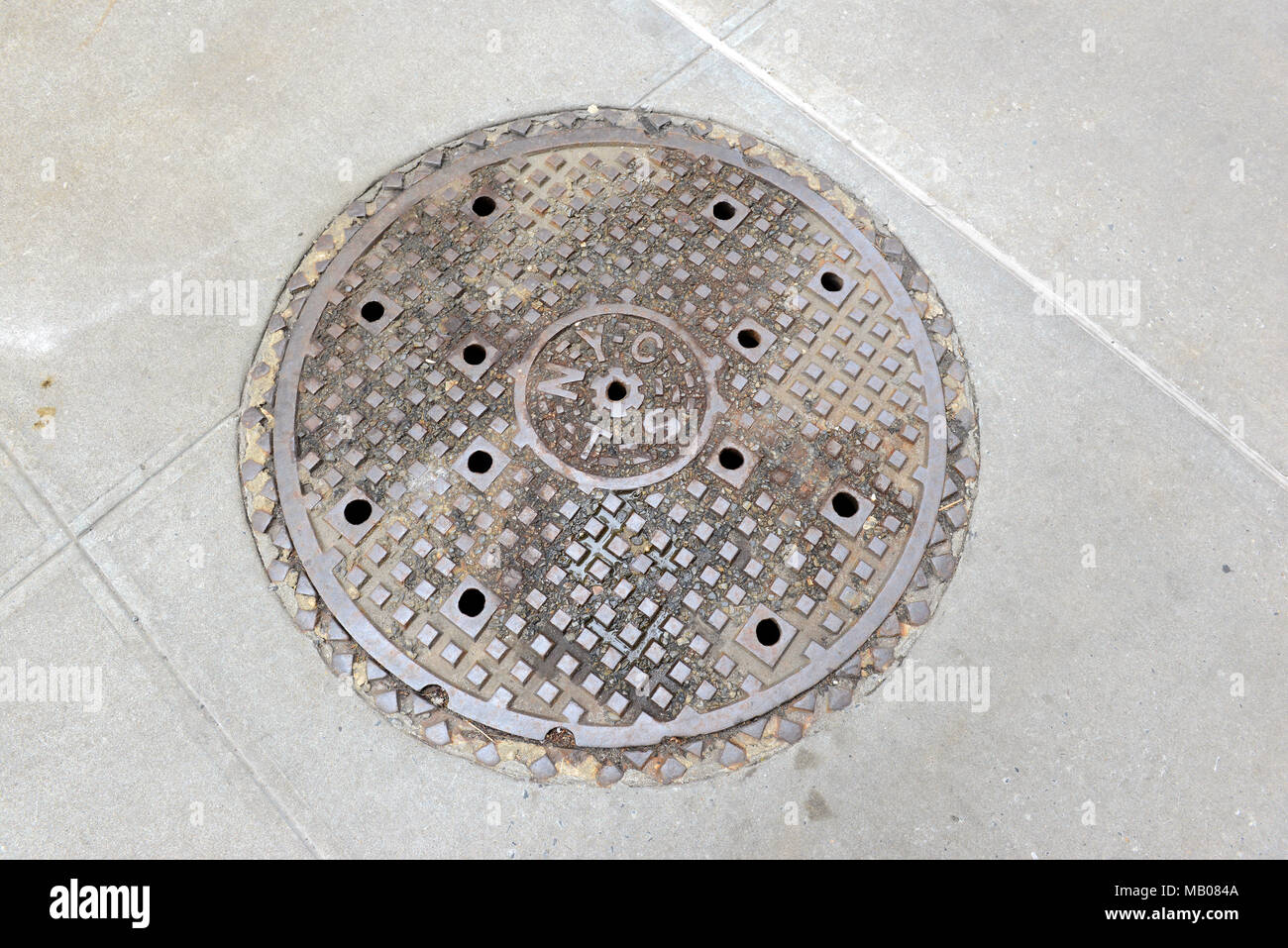 Manhole covers on street in Manhattan New York, used to cover old ...