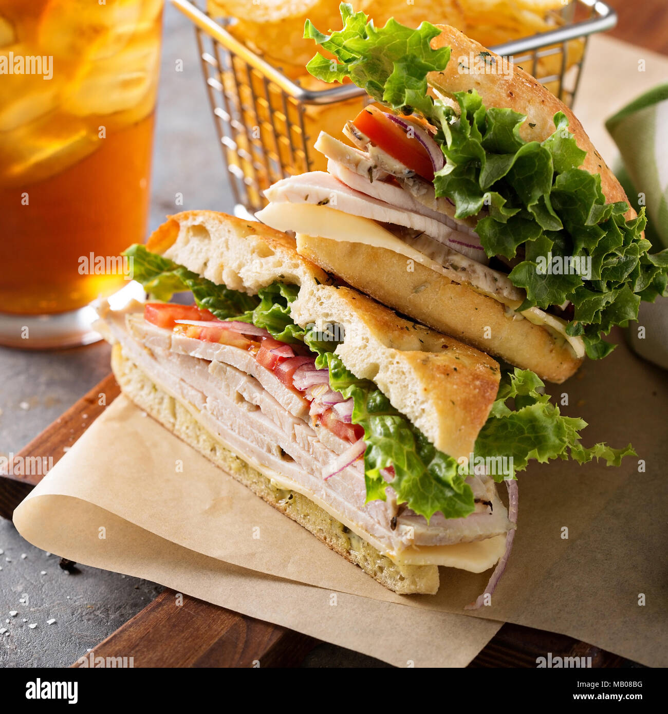 Turkey sandwich with cheese, tomato, lettuce and herb mayonnaise Stock ...
