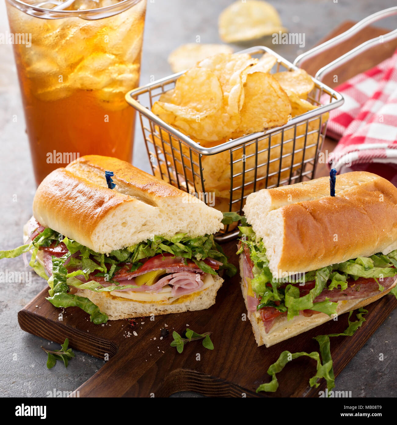 Italian sub sandwich with salami, ham and chips with copy space Stock ...