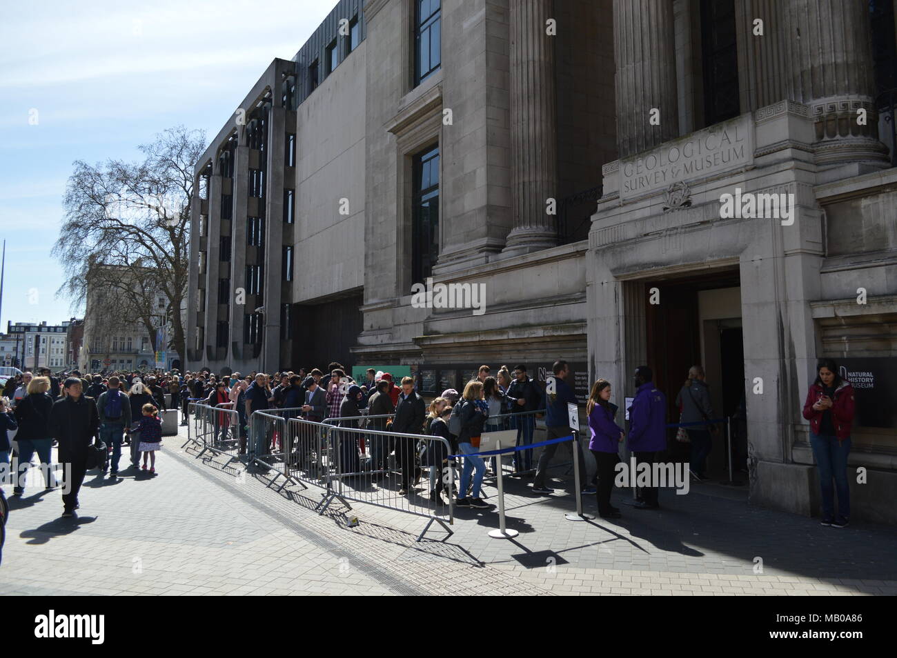 People queue outside the natural history museum in south kensington hi ...
