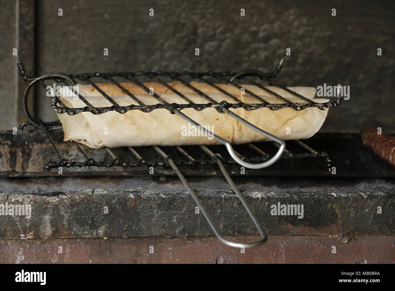 Delicious grilled meat with a wrap all from the grill Stock Photo - Alamy
