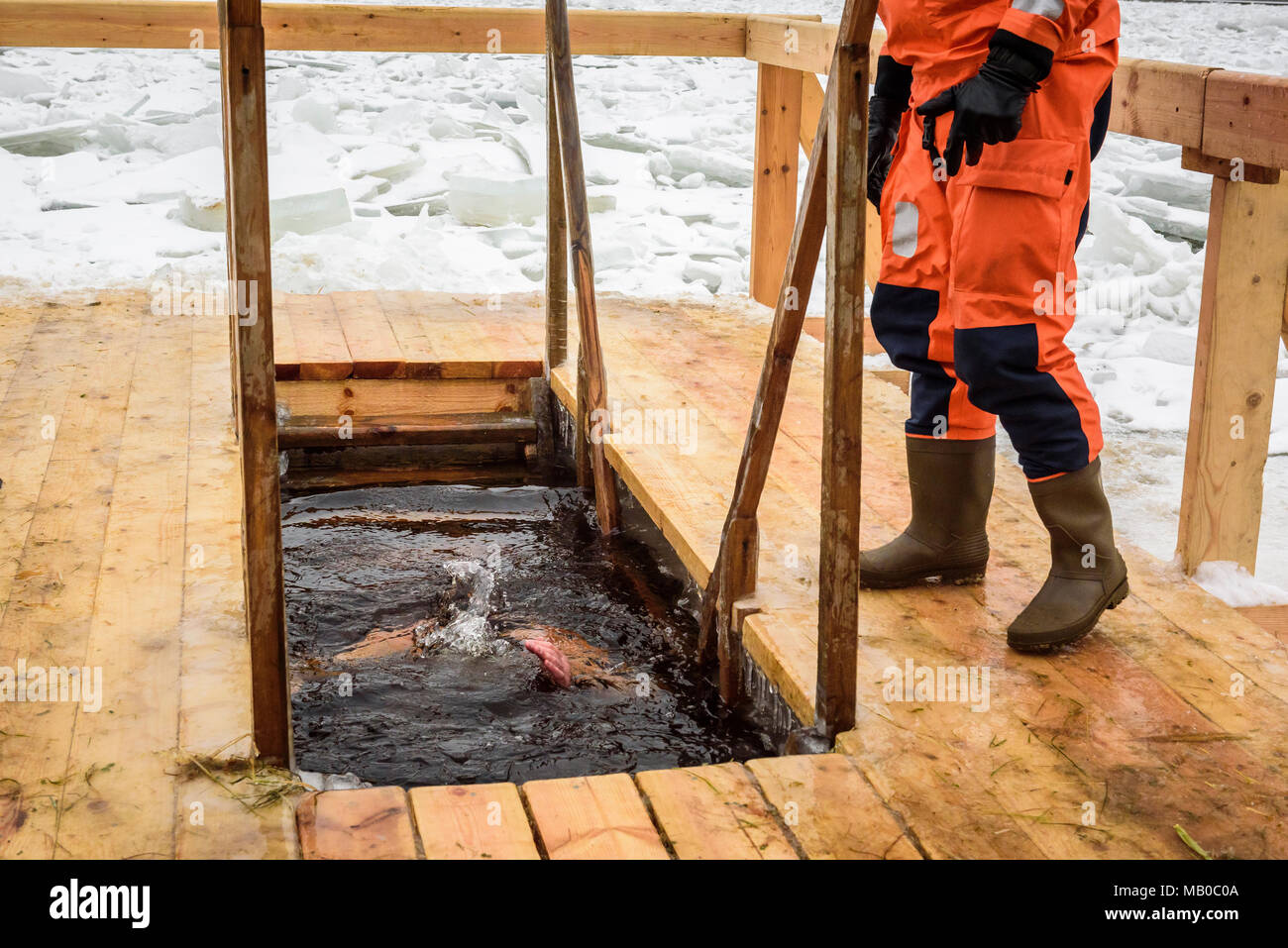 Epiphany ice hole diving in the Neva river in St Petersburg, Russia ...