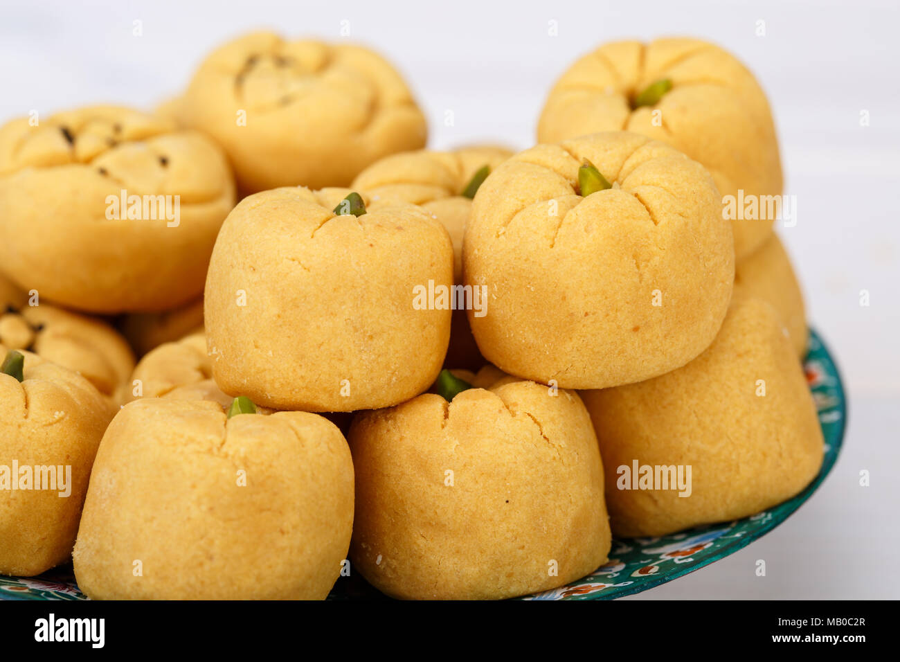 Round shaped Chickpea cookie pastries made of gram flour and Pistachio ...
