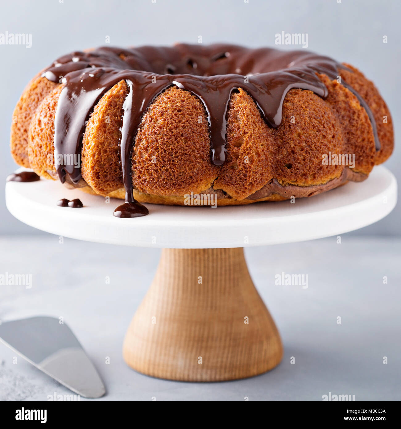 Vanilla bundt cake with chocolate glaze on top Stock Photo - Alamy