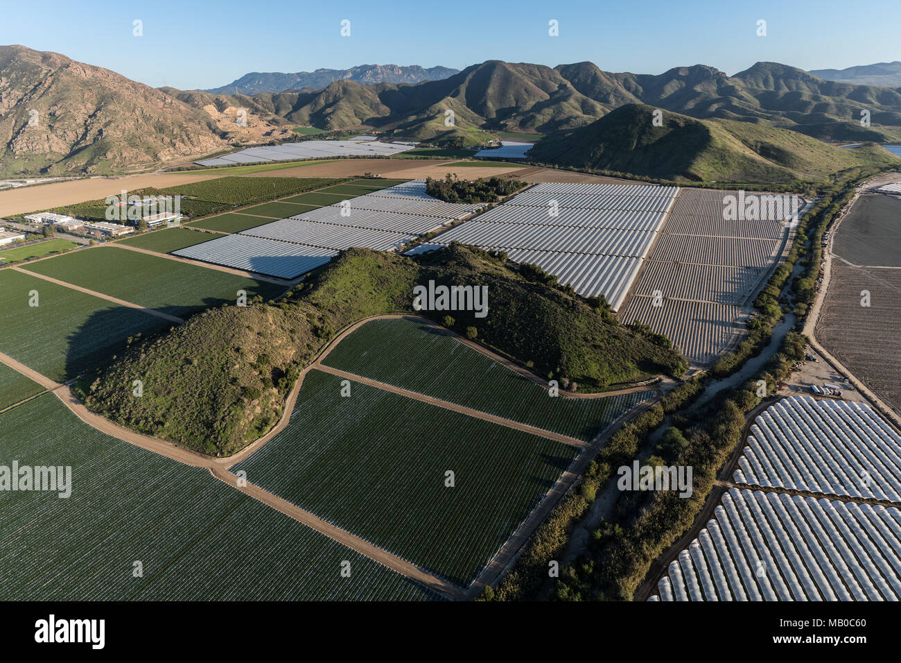 Aerial view of coastal farm fields and Santa Monica Mountains foothills ...