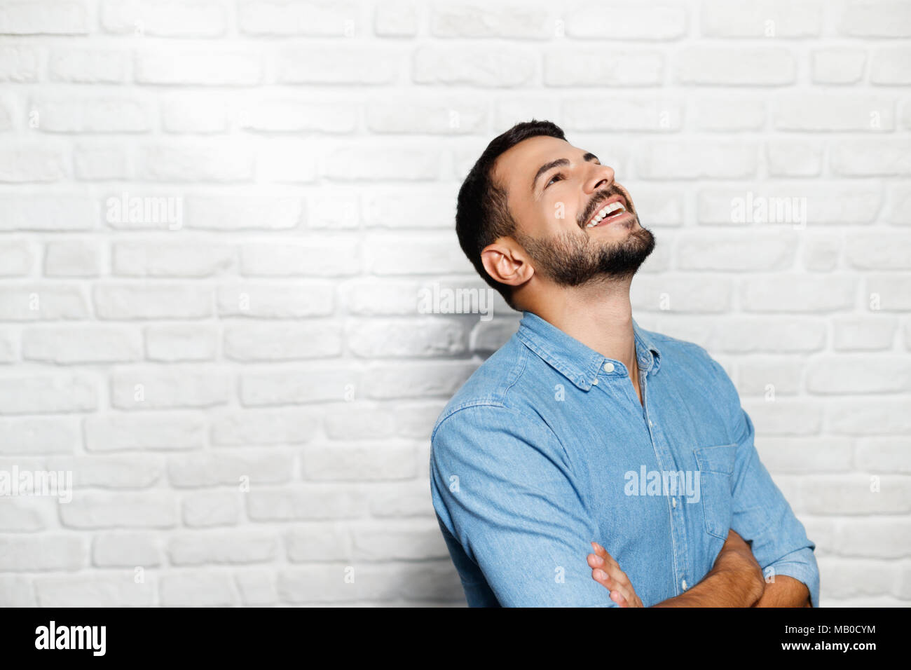 Man portrait brick wall hi-res stock photography and images - Alamy