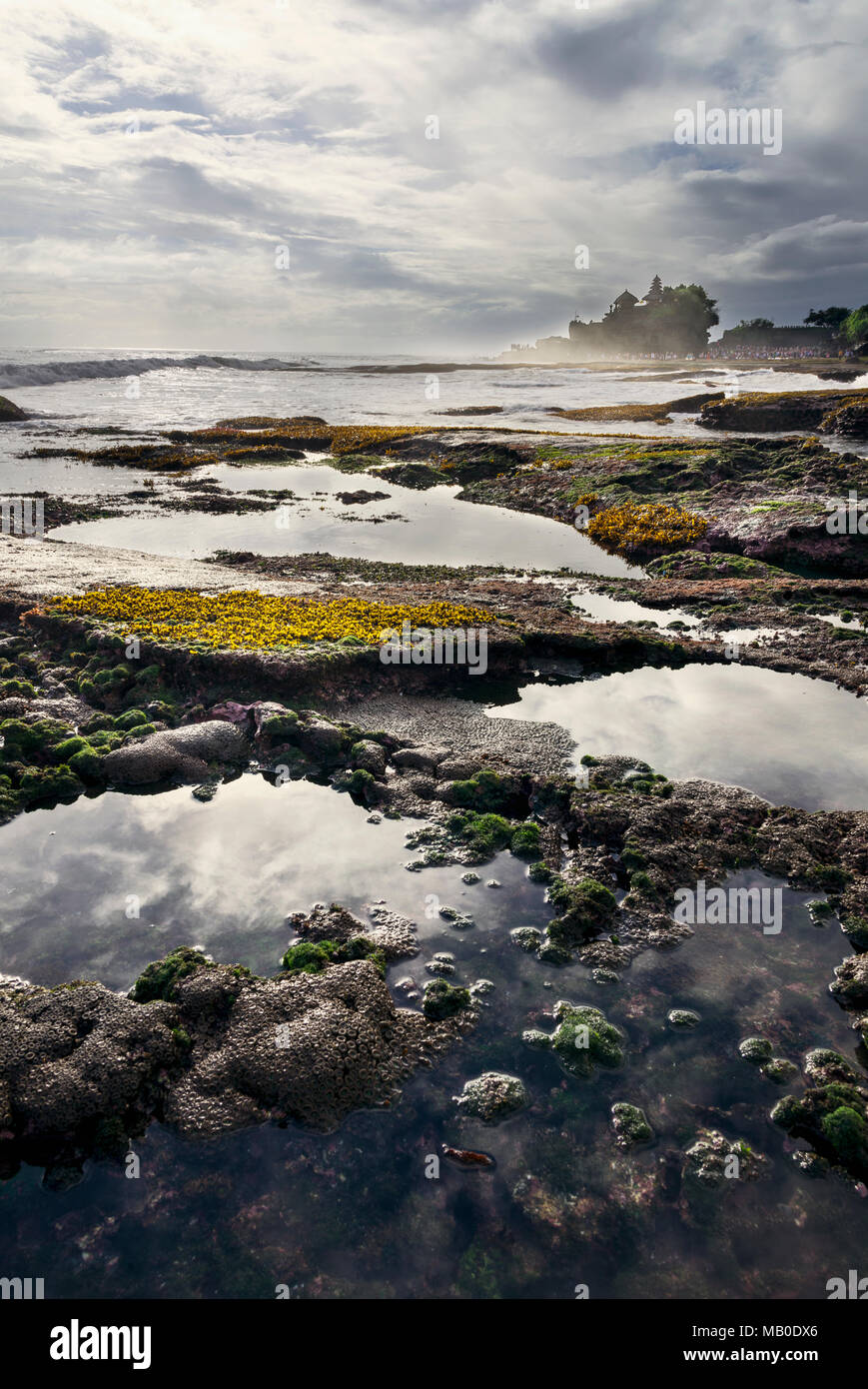 Vertical Landscape with Tanah lot temple while ocean tide at Bali ...