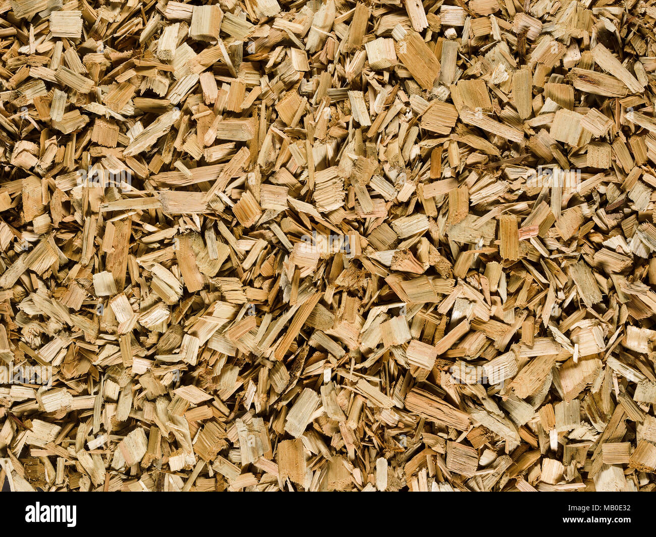 Light brown tan wood chips create abstract rough-textured organic ...