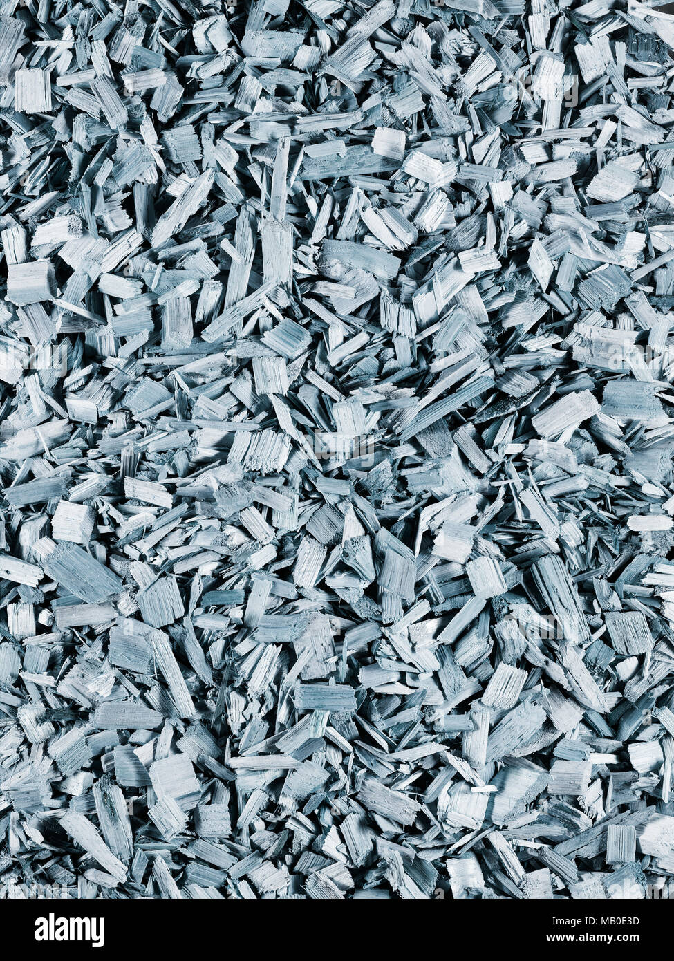 Cool blue grey wood chips create abstract rough-textured organic ...