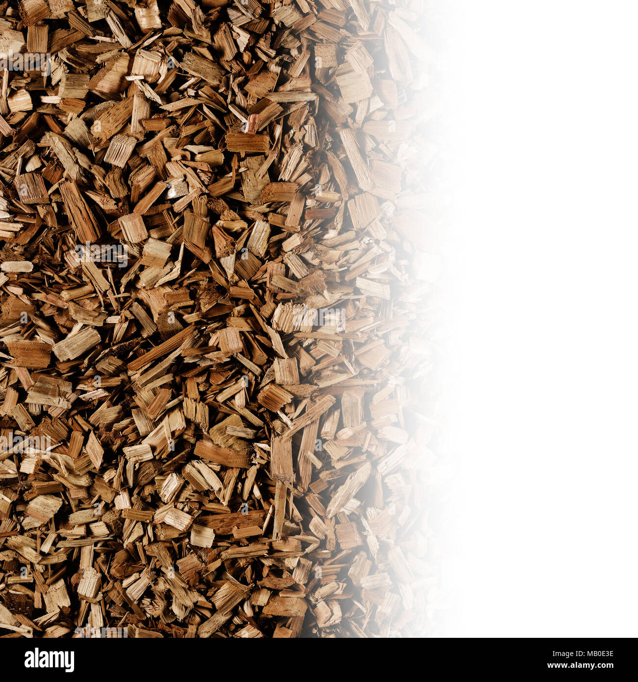 Dark brown wood chips create abstract rough-textured organic background ...