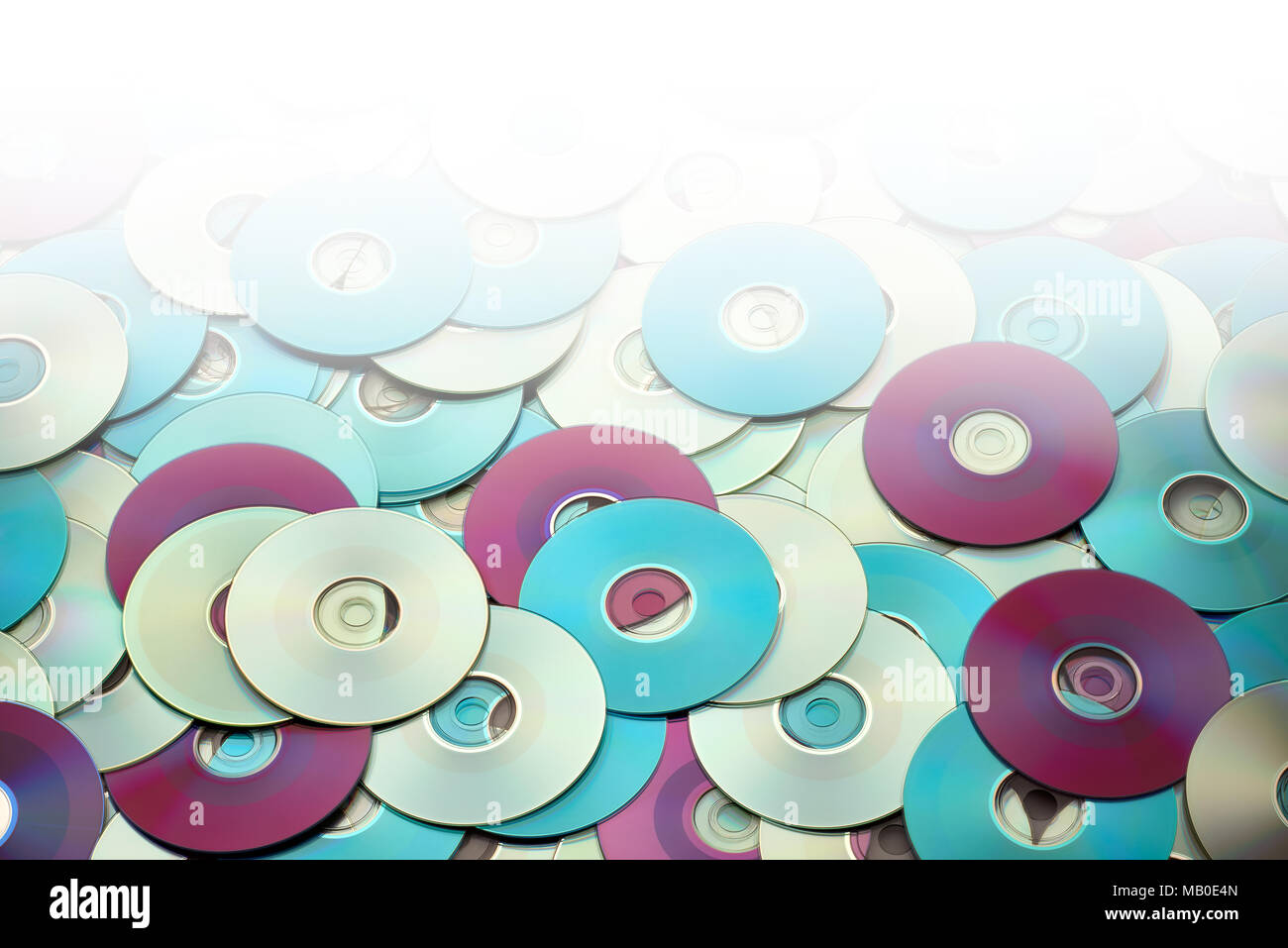 Random colorful DVD and CD disks create data concept background with ...