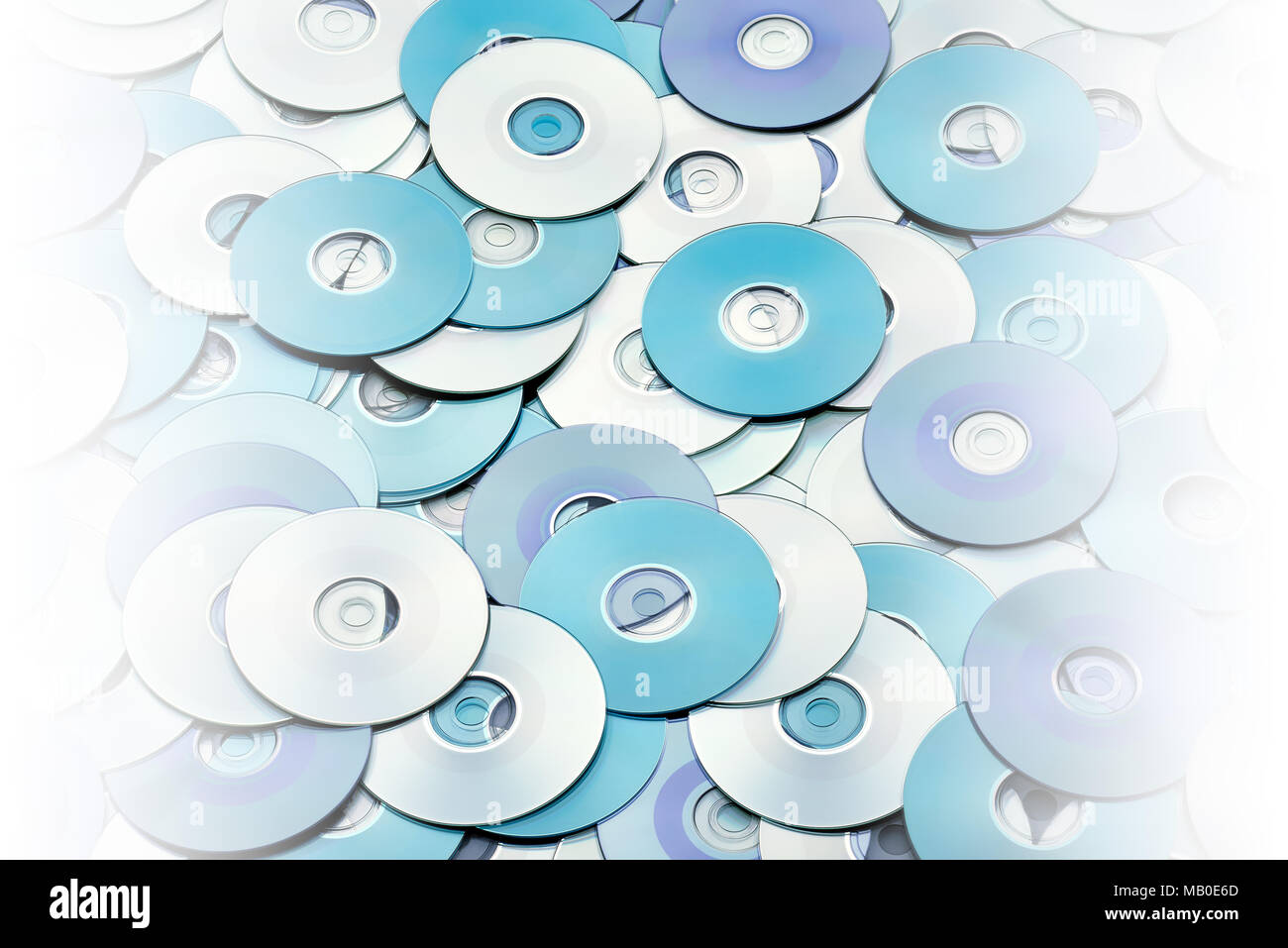 Random arrangement of blue grey DVD and CD disks create data concept ...