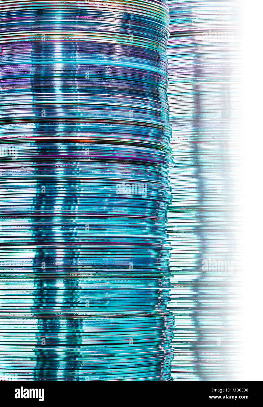 Stacks of cool blue translucent DVD and CD computer storage disks ...