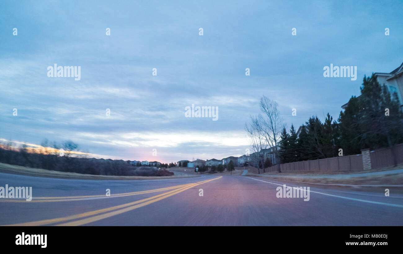 Driving on suburban road early in the morning Stock Photo - Alamy