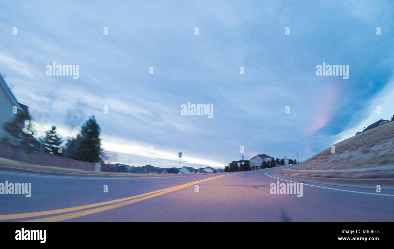 Driving on suburban road early in the morning Stock Photo - Alamy