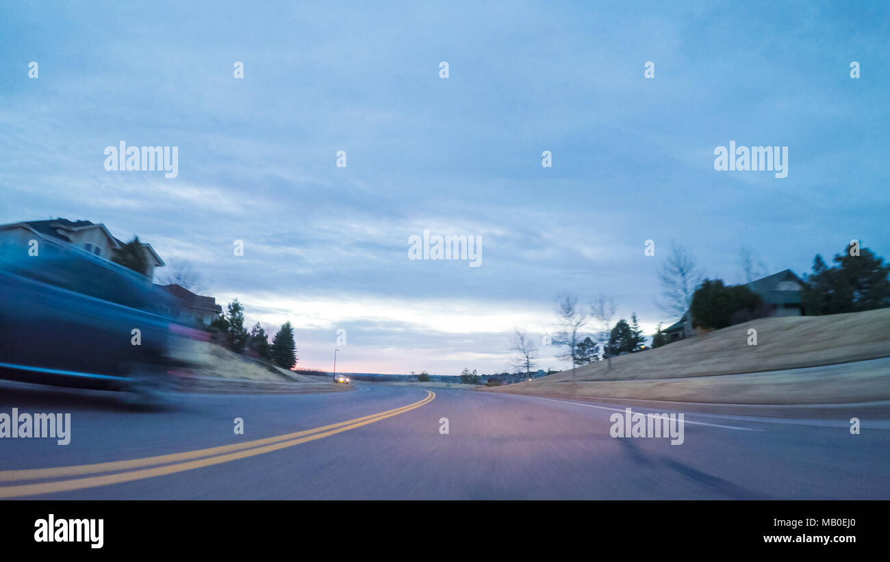 Driving on suburban road early in the morning Stock Photo - Alamy