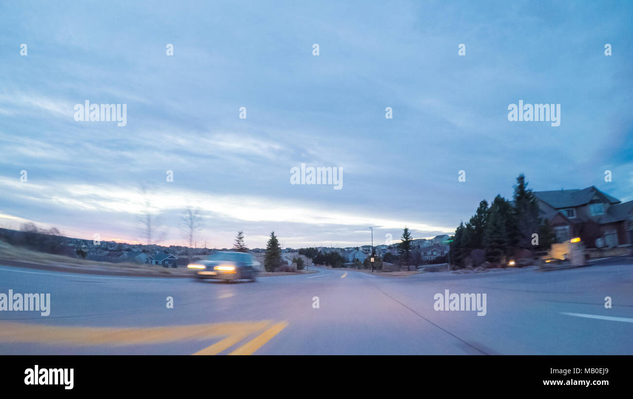 Driving on suburban road early in the morning Stock Photo - Alamy