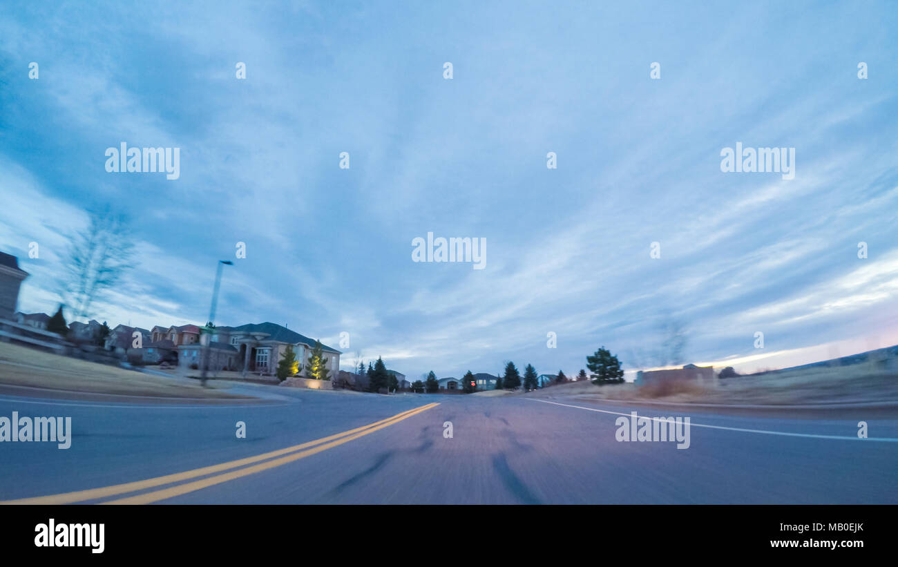 Driving on suburban road early in the morning Stock Photo - Alamy