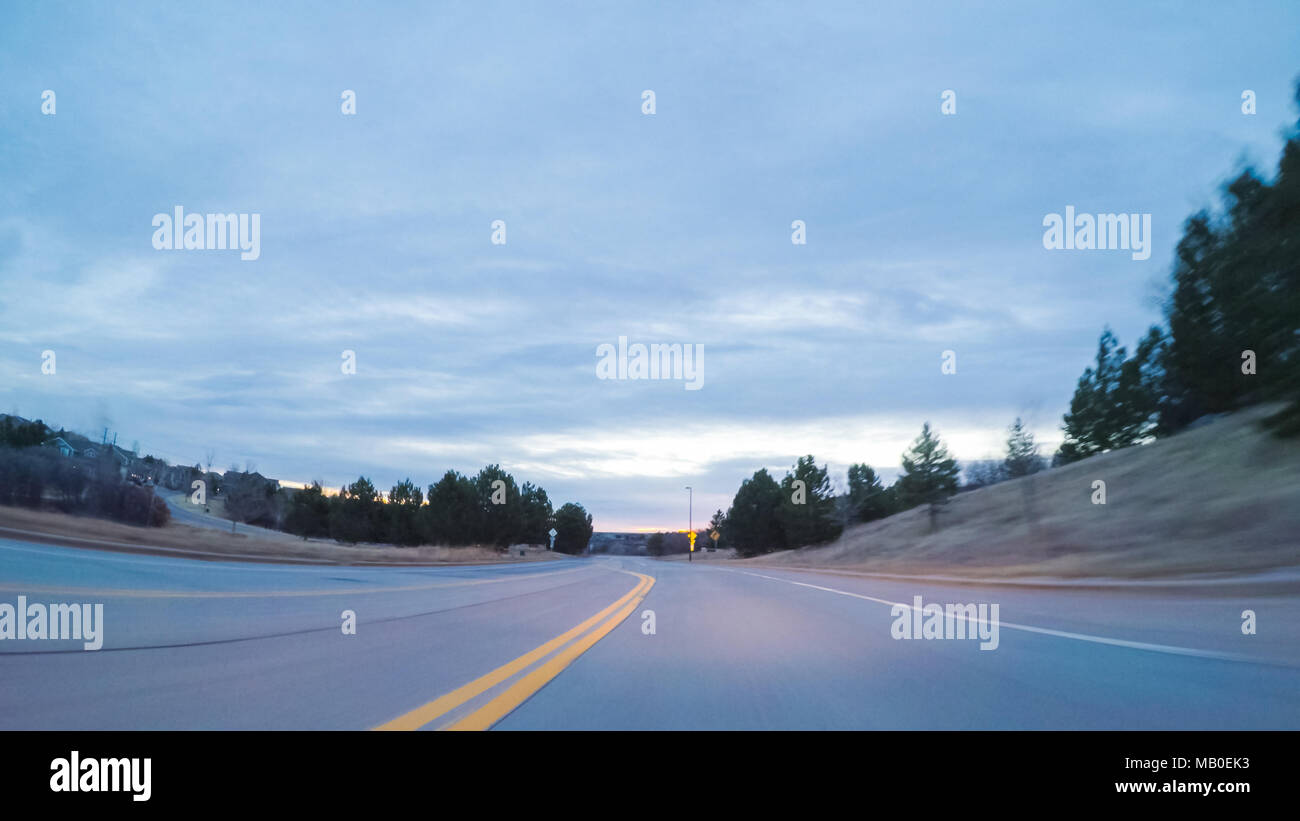 Driving on suburban road early in the morning Stock Photo - Alamy