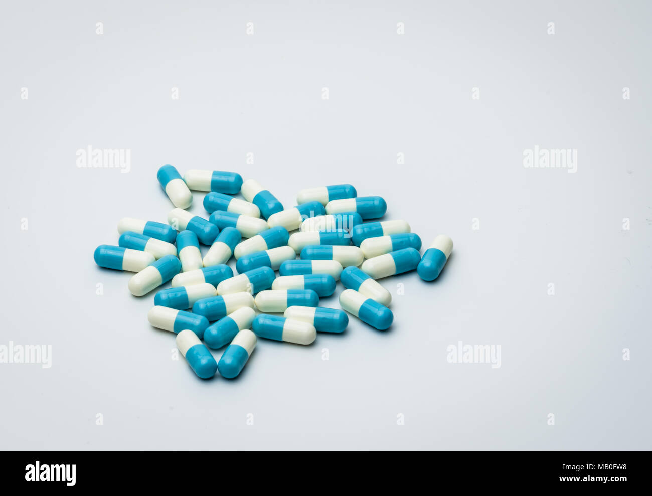 Blue and white capsules pills isolated on white background with copy ...