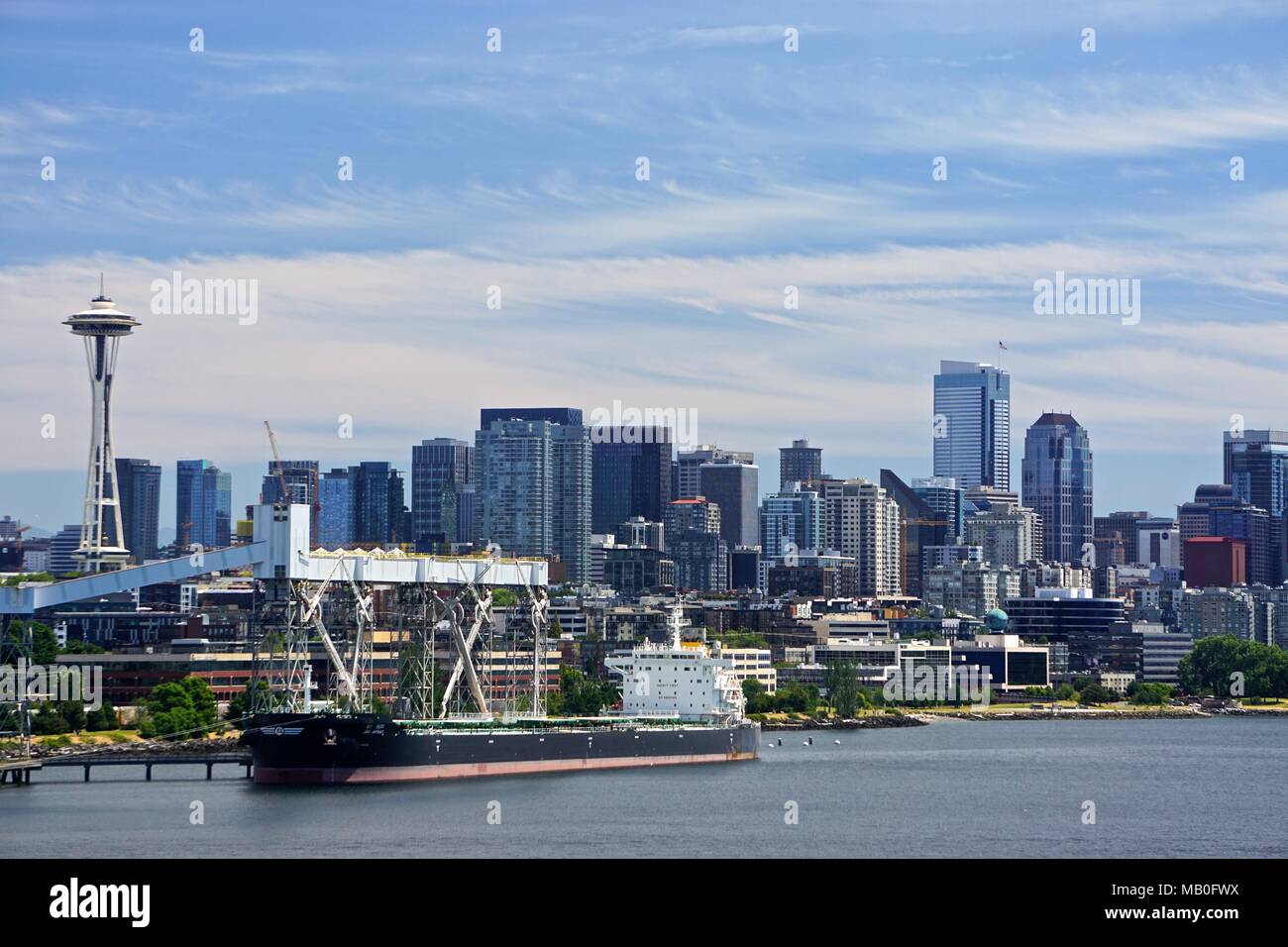 Seattle, Washington: View of the Seattle skyline and a cargo ship in ...