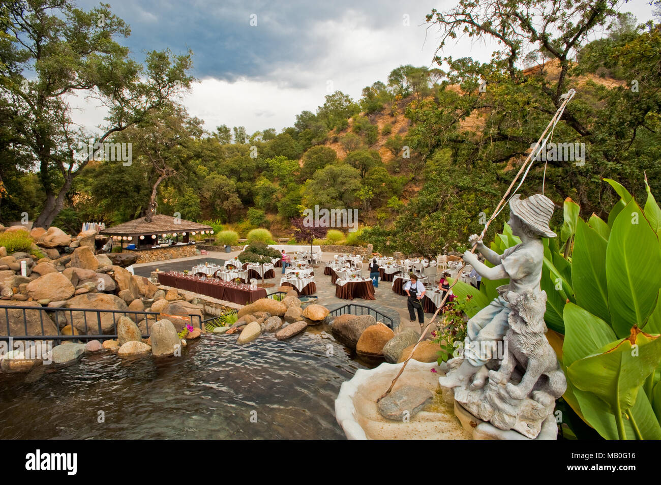 Tables set up for an outdoor wedding reception at a resort in ...