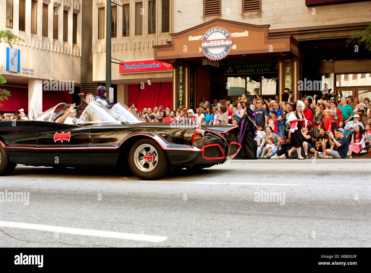 Atlanta, GA, USA - August 31, 2013: Batman rides in the batmobile down ...