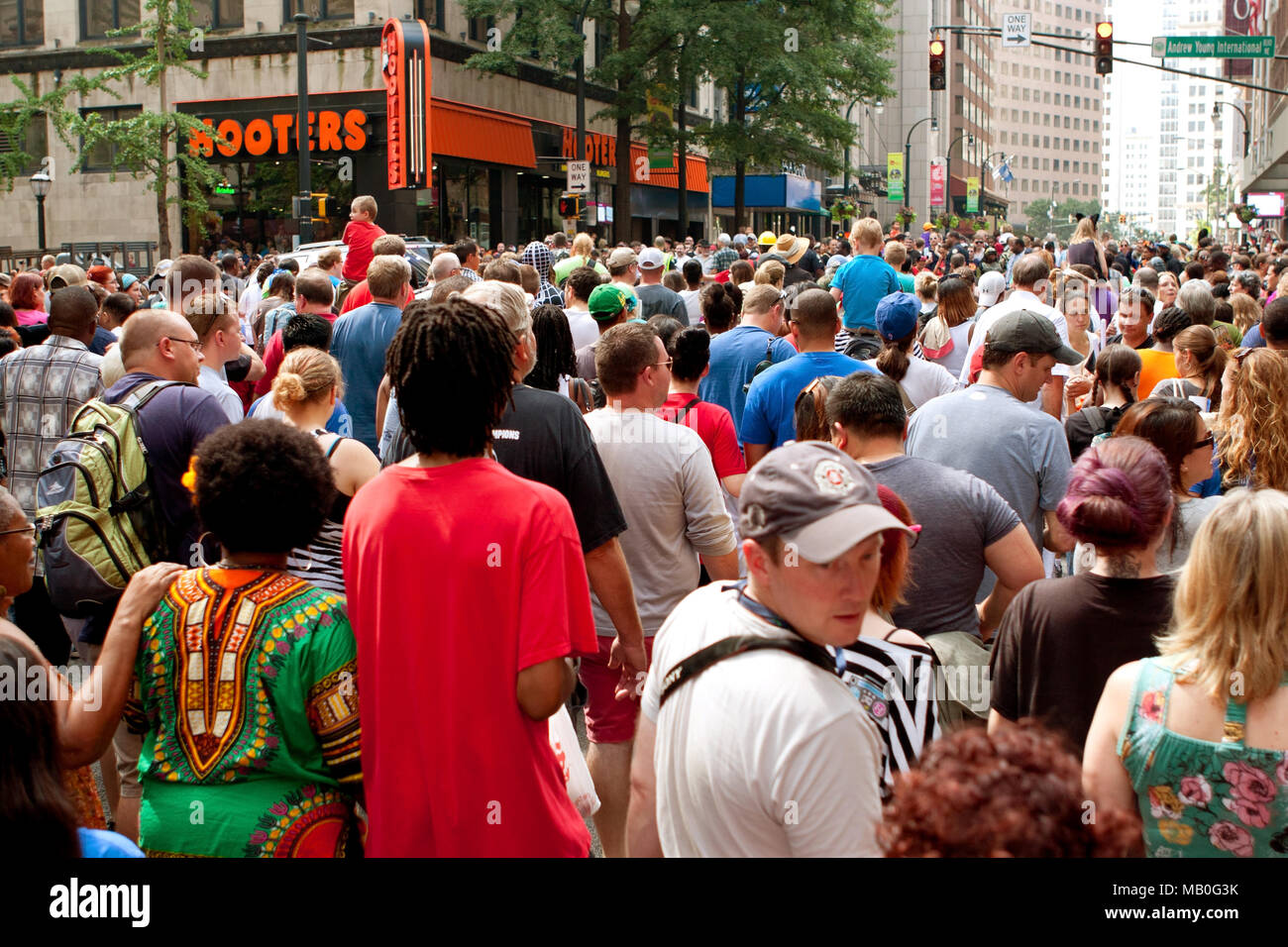 A huge crowd of spectators fills Peachtree Street at the conclusion of ...