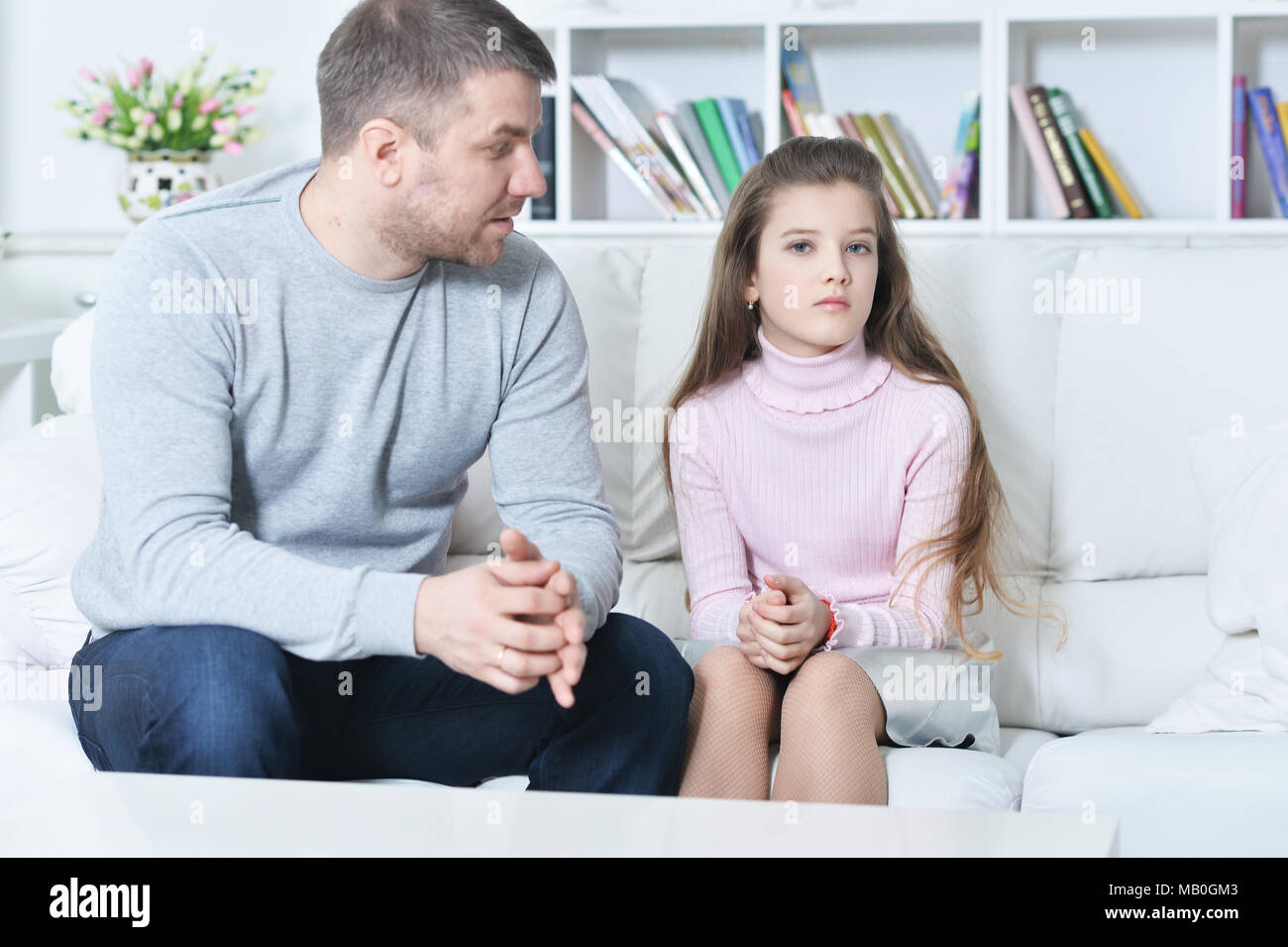 Girl talking with her father Stock Photo - Alamy