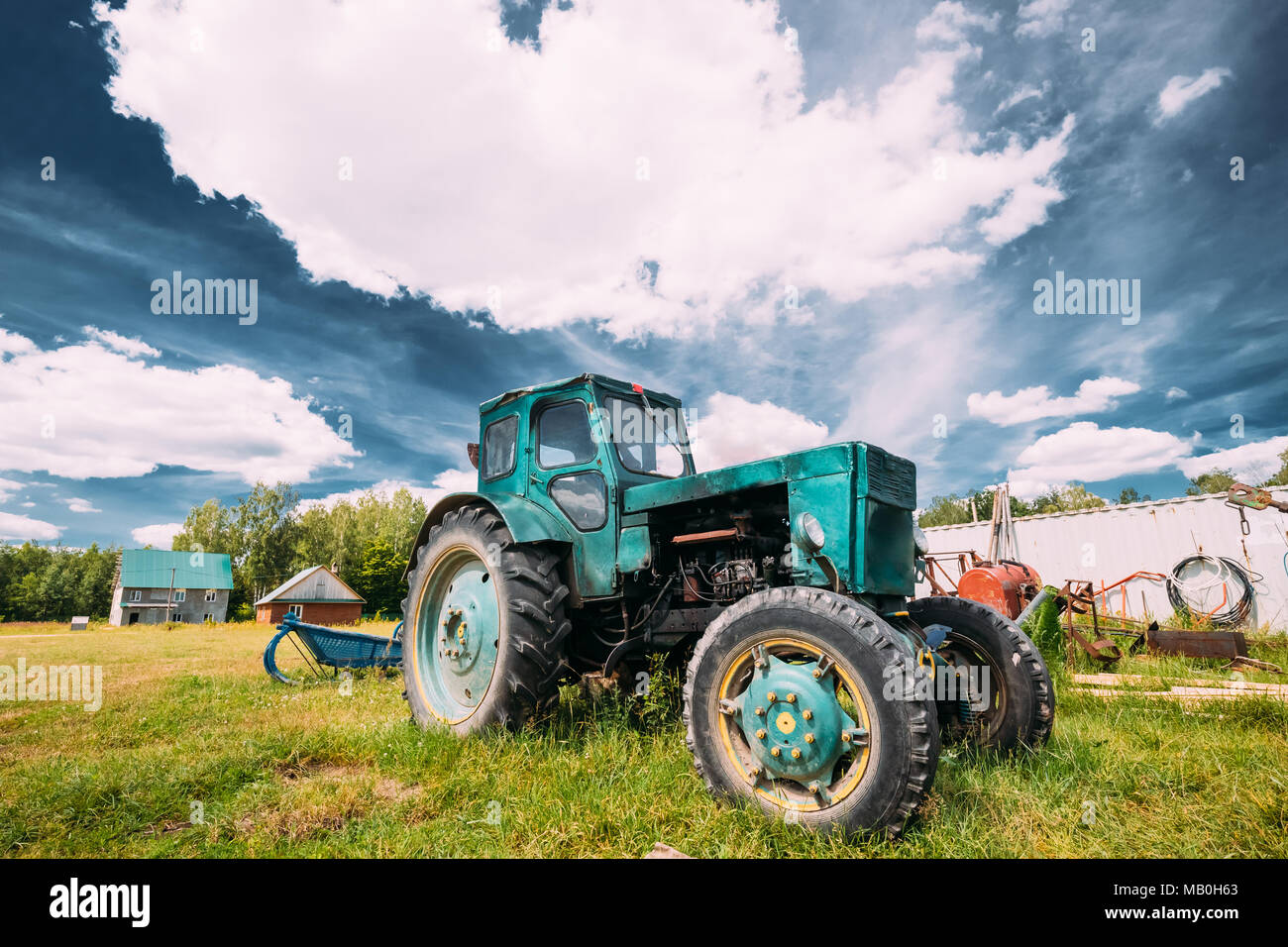 Old Tractor Parking In Backyard In Summer Sunny Day. Special ...