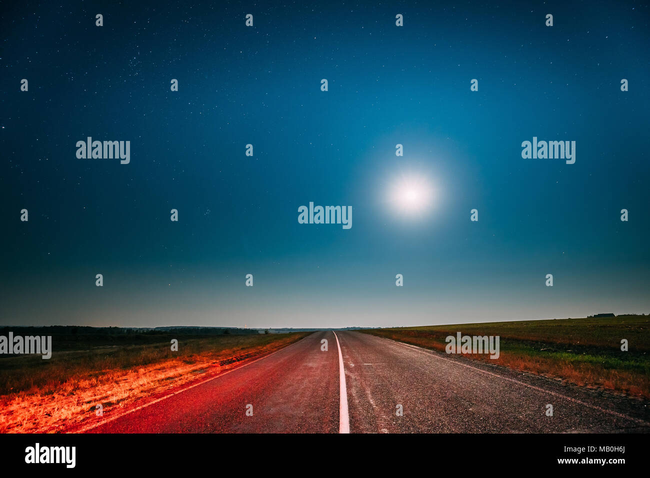 Blue Night Starry Sky With Moon Above Country Asphalt Road In ...